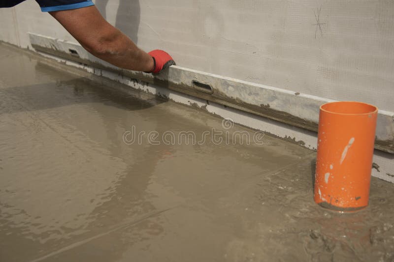 Mason Leveling and Screeding Concrete Floor Base Stock Photo - Image of ... Mason Leveling and Screeding Concrete Floor Base Stock Photo - Image of ...