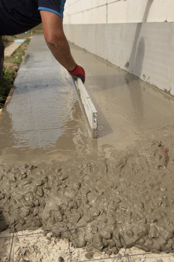 Mason Leveling and Screeding Concrete Floor Base Stock Photo - Image of ... Mason Leveling and Screeding Concrete Floor Base Stock Photo - Image of ...