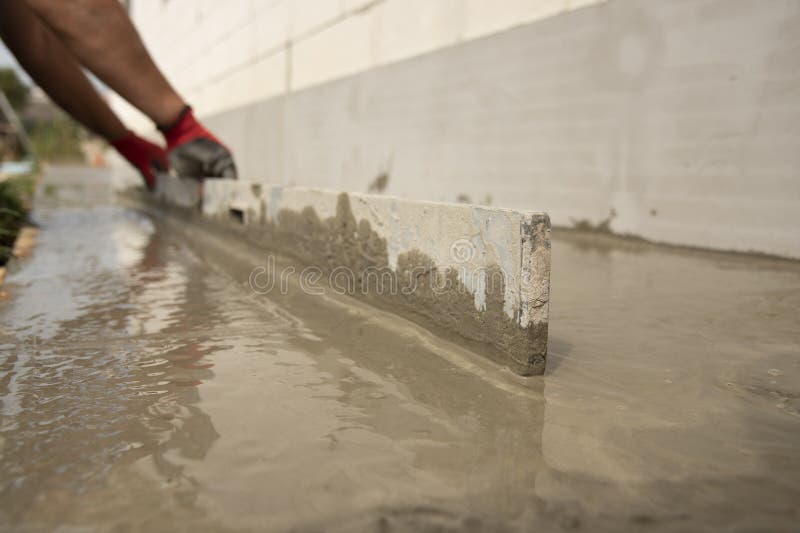 Mason Leveling and Screeding Concrete Floor Base Stock Image - Image of ... Mason Leveling and Screeding Concrete Floor Base Stock Image - Image of ...