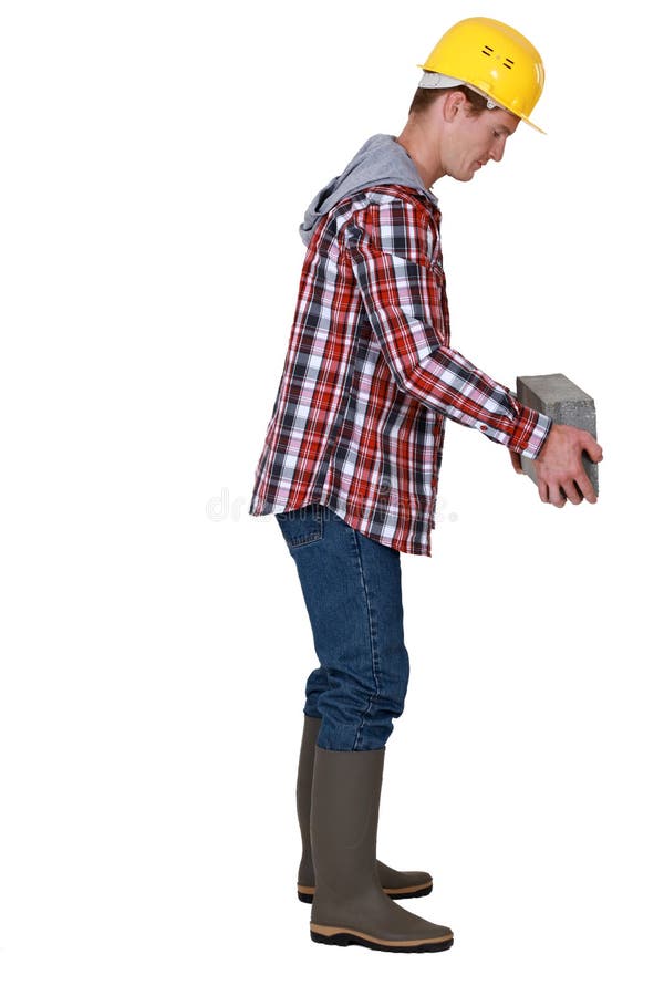 Mason lifting brick stock photo. Image of bricklayer - 33671528