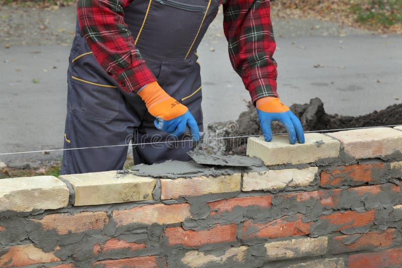 Worker Building Brick Wall Using Trowel Stock Image - Image of ...