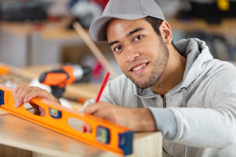 Mason Measuring Plank Wood in Workshop Stock Photo - Image of contract ...