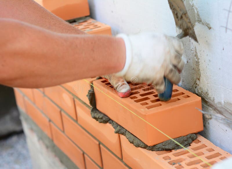 A Mason Person is Building Brick House Wall Stock Image - Image of ...