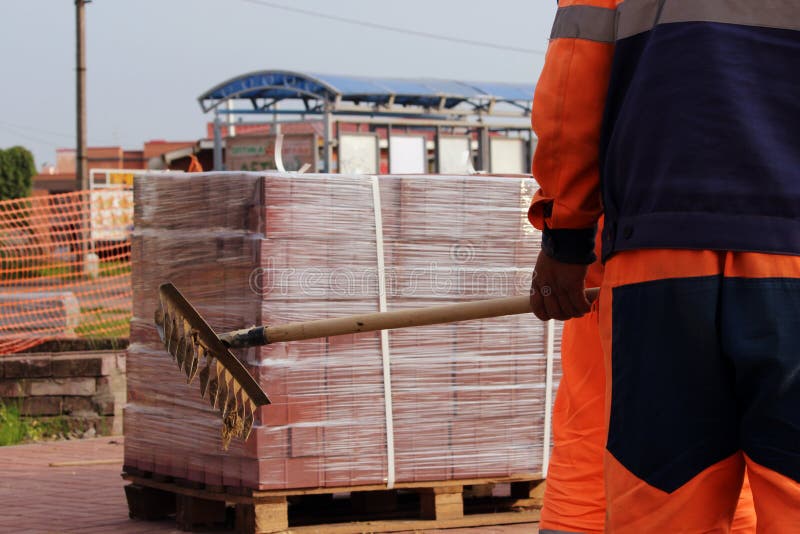 Mason in the Town Square Leveled Sand Rake As the Basis for Paving ...