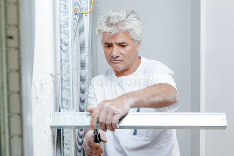 Mason using pliers stock image. Image of bricklayer - 266720283