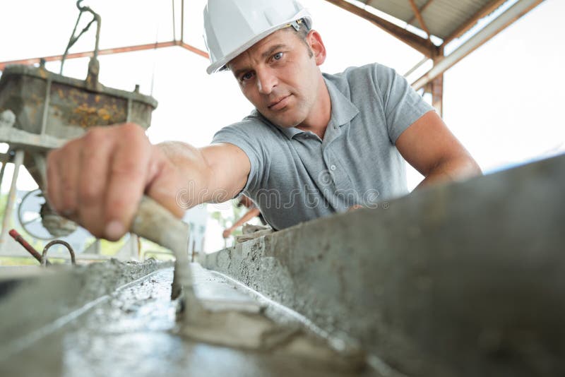 Mason using trowel stock image. Image of level, builder - 244332673