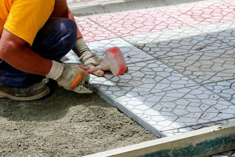 Mason Worker Making Sidewalk Pavement with Concrete Blocks Stock Image ...