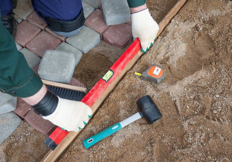 Mason Worker Making Sidewalk Pavement Stock Image - Image of level ...