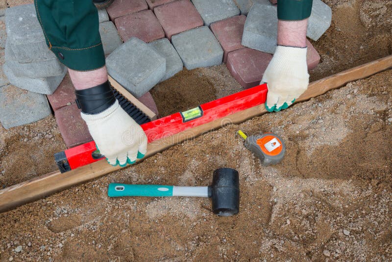 Mason Worker Making Sidewalk Pavement Stock Photo - Image of pavement ...