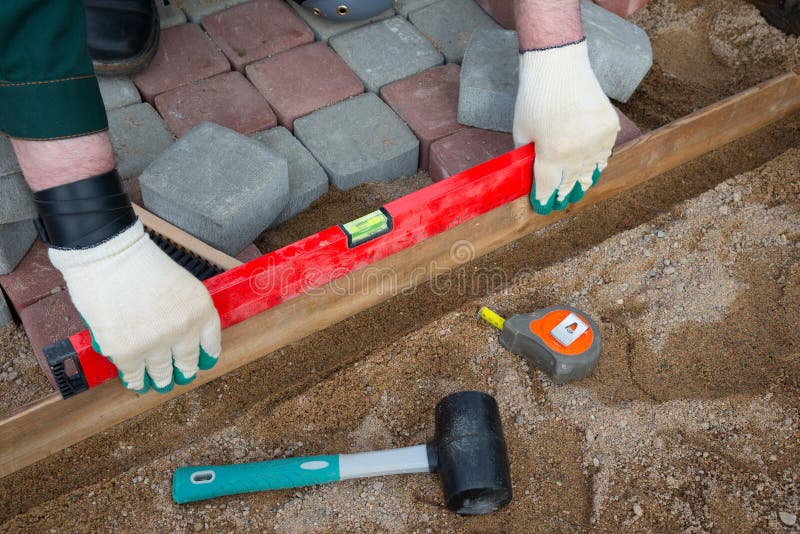 Mason Worker Making Sidewalk Pavement Stock Image - Image of pedestrian ...
