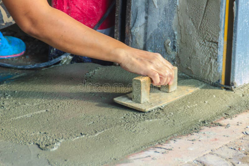 Mason Worker Leveling Concrete with Trowels, Mason Hands Spreading ...