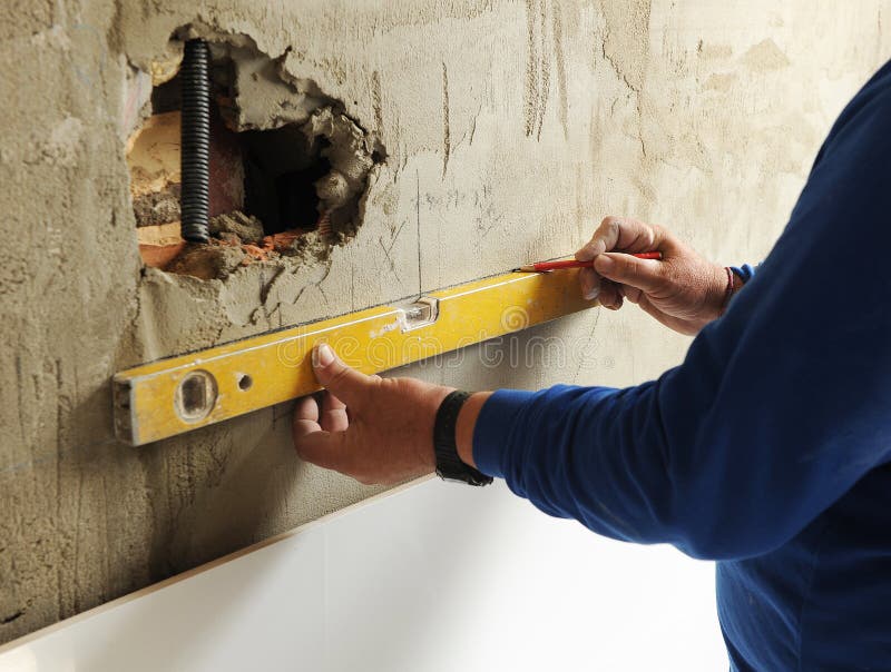Construction Worker Marking a Horizontal Line with the Level Tool Stock ...