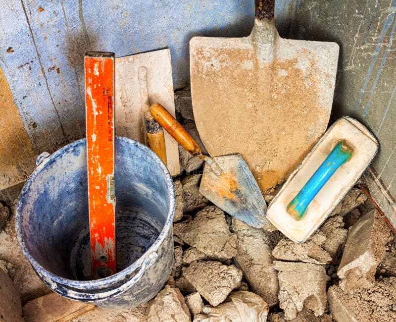 Masonry Tools on an Unfinished Wall Stock Photo - Image of indoors ...