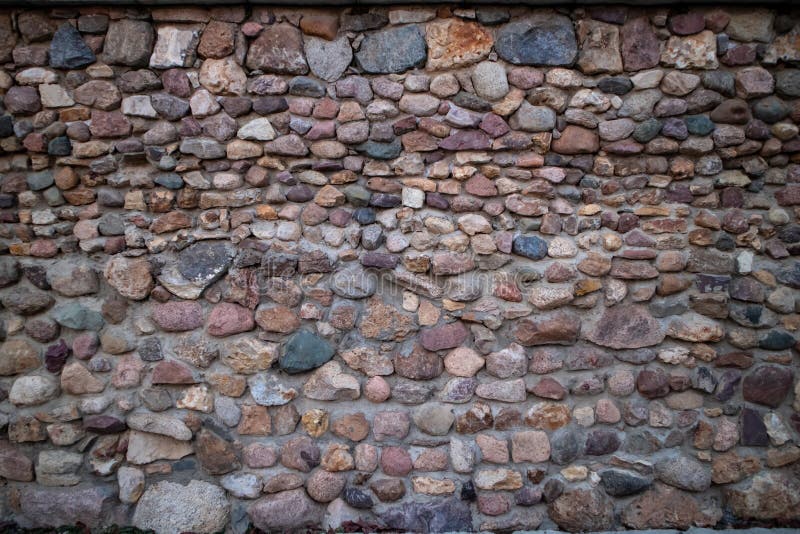 Masonry wall wind stones stock photo. Image of colored - 131956790