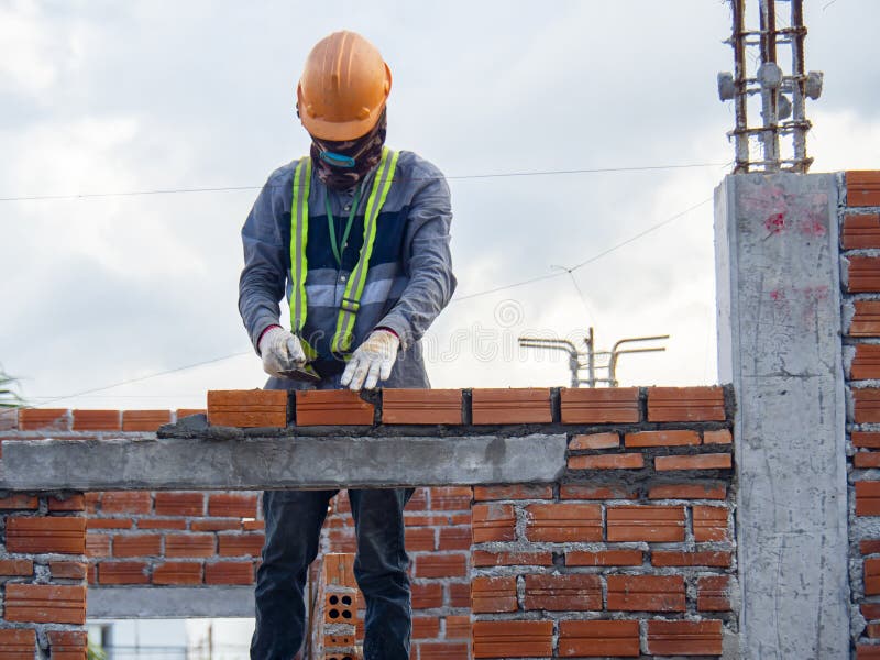 Masonry Work, Worker Laying Brick of an Office Building. Architectural ...