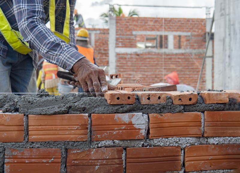 Closeup of Worker Laying Brick at Construction Site. Masonary Work ...