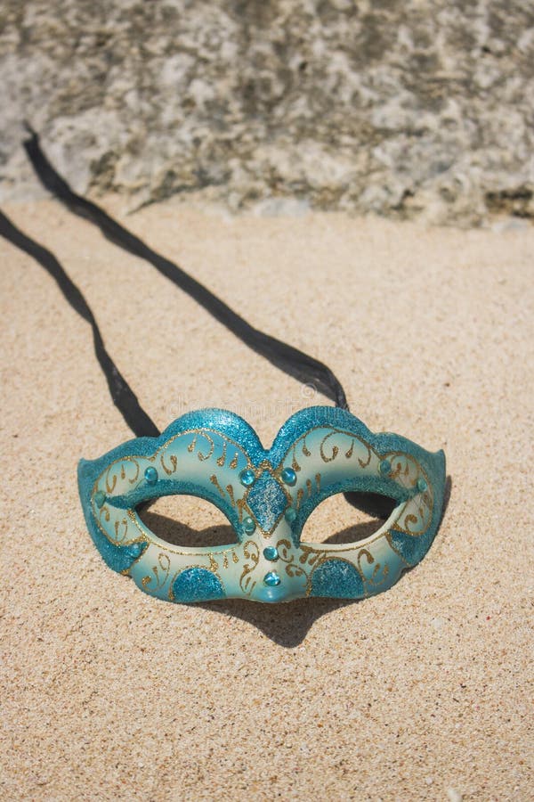 Masquerade Party Mask on Beach View Stock Photo - Image of beach, sand ...