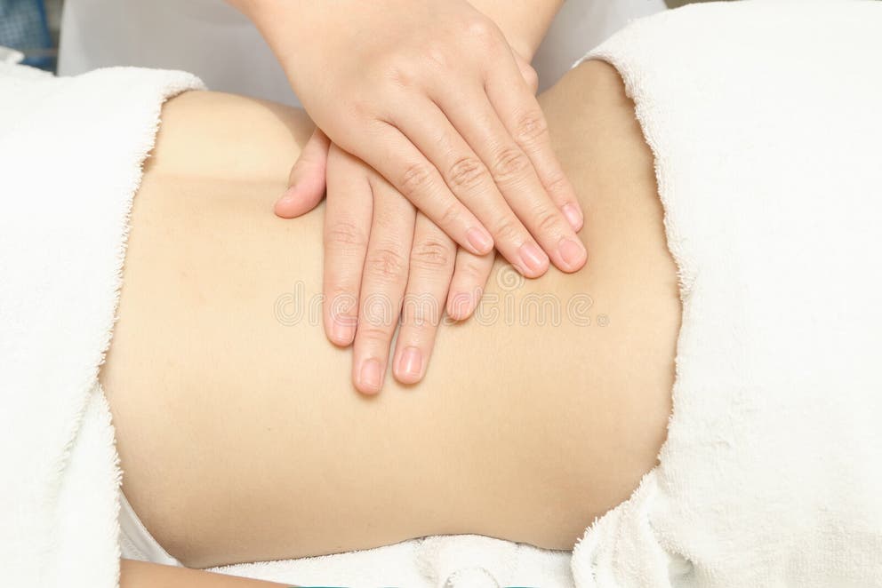 Masseur Applying Massage Techniques To Relax Back Muscles in Stock ...