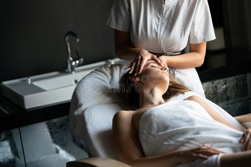 Masseur Doing Massage On Woman Body In The Spa Salon Stock Image