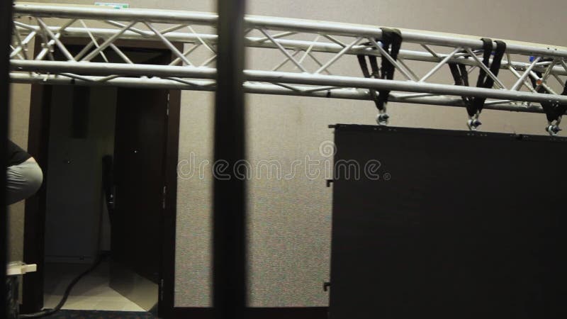 Big Black Screen in Being Mounted by Group of Young Male Workers in ...