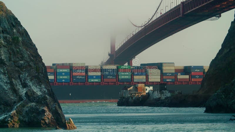 A Massive Cargo Ship Barely Fits during a Pass Under the Golden Gate ...