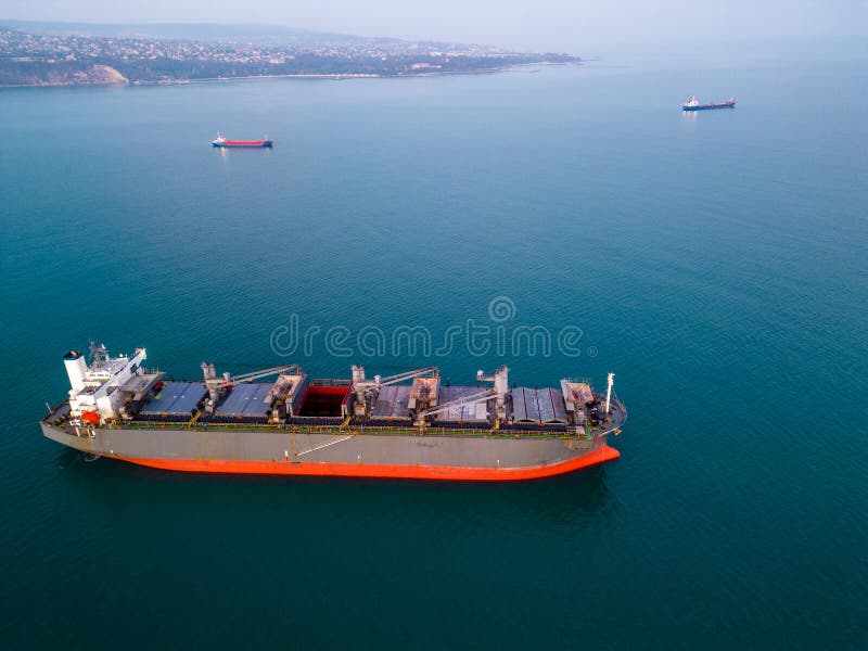 A Massive Cargo Ship Wood Chips Carrier in the Sea, Aerial View Stock ...