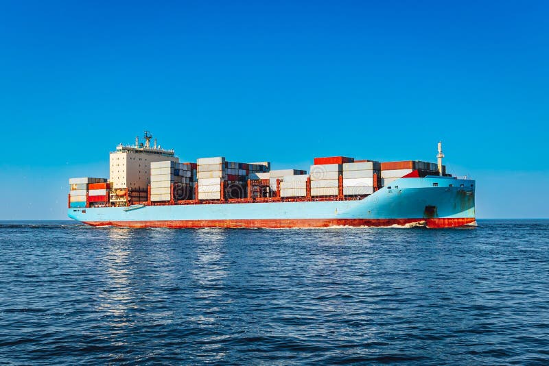 A Large Container Ship Sailing Down the Ocean on Clear Day Stock Photo ...