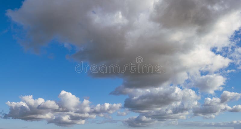 Massive Clouds Float on a Clear Day. Wide Horizon and Clear Sky Stock Image - Image of skyline ...
