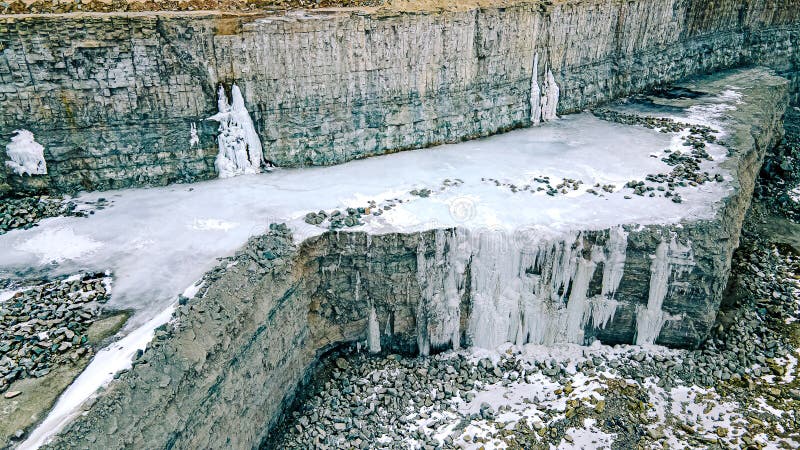 Snow Melting and Freezing on the Rock Walls Stock Image - Image of ...