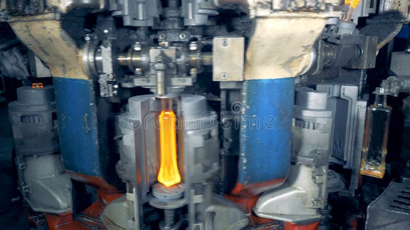 Massive Rotating Factory Machine from Which Glass Bottles are Getting ...