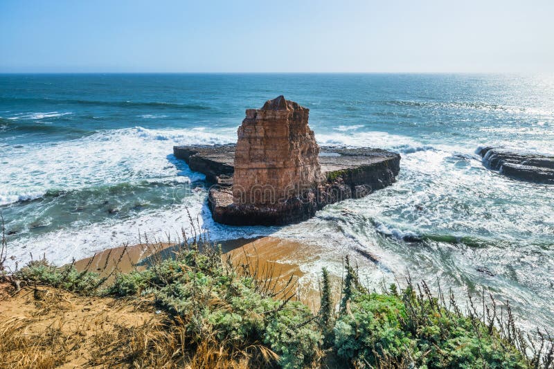 Massive Sea Stack Rising from the Waves at Four Mile Beach, California ...