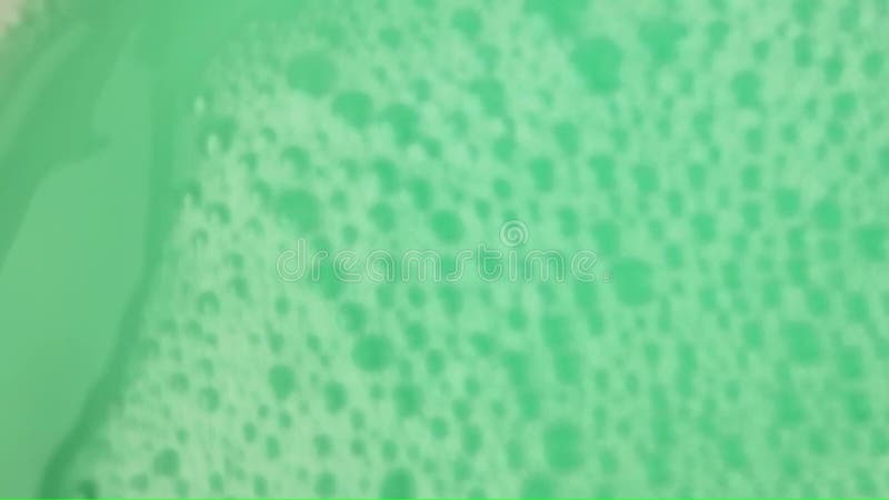 A Massive Swinging Turquoise Green Surface with Bubbles. Swinging Water ...