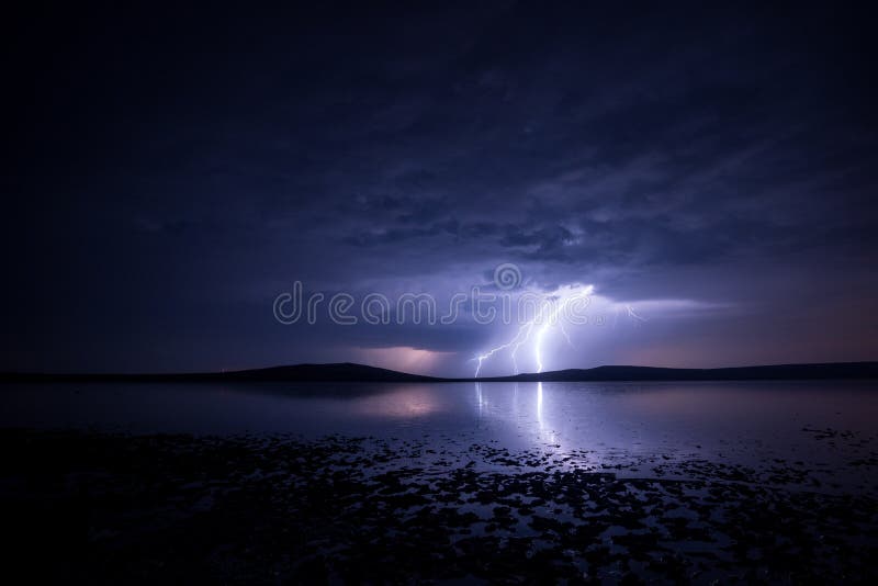 Massive Triple Lightning Over the Lake with Reflection Stock Photo ...