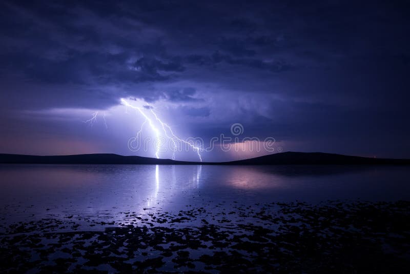 Massive Triple Lightning Over the Lake with Reflection Stock Image ...