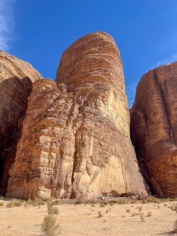 Massive Vertical Sandstone Cliff in the Wadi Rum Desert, Jordan Stock ...