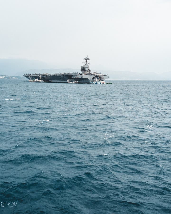 Massive Vessel Sails Alongside Another Ship in the Vast Ocean Stock ...