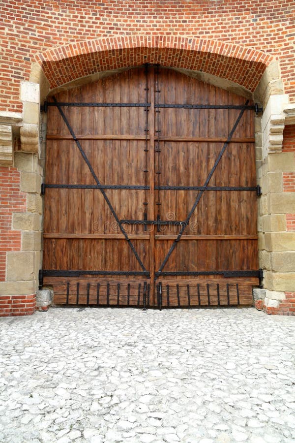 Massive Wooden Entrance Door To Modern White House with Paving Footpath ...