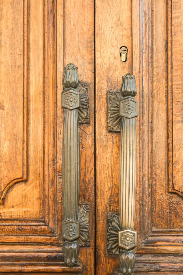 Massive Wooden Doors with Big Metal Handles on the Old Building Close ...