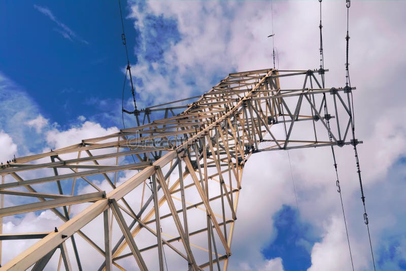 Mast of a High-voltage Power Line Against the Blue Sky Stock Photo ...
