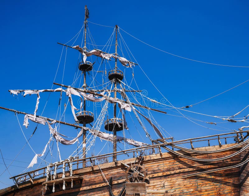 Mast with Sails on Ancient Wooden Pirate Ship on Background of Blue Sky ...