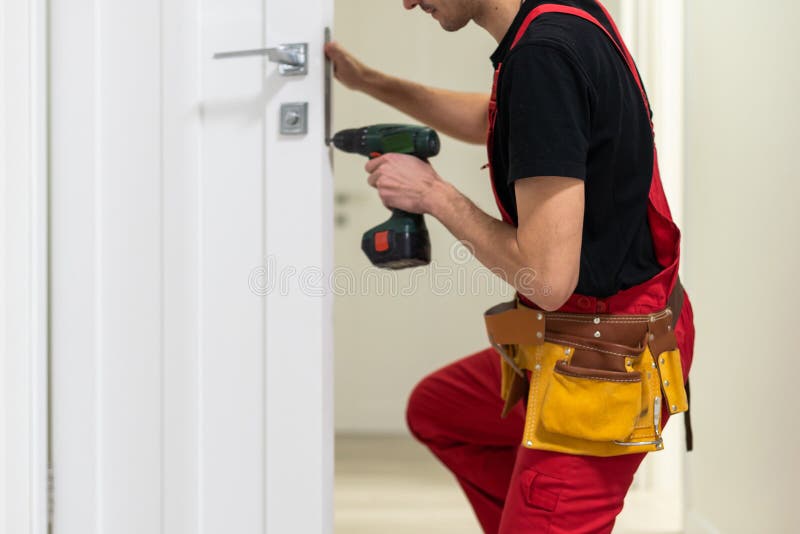 The Master Adjusts the Fittings in the Doors. the Plastic Door Jammed ...