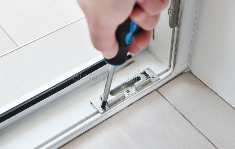 The Master Adjusts the Fittings in the PVC Plastic Doors. the Plastic ...