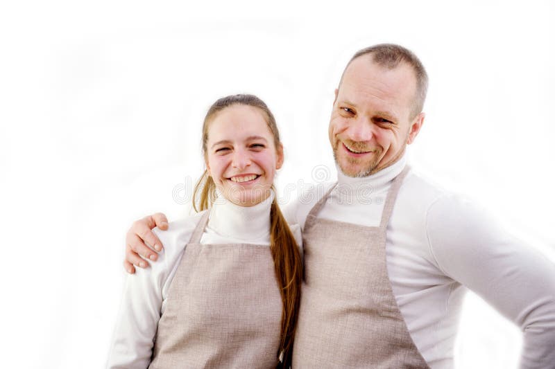 Master and Apprentice on Two People Beige Kitchen or Technical Aprons ...