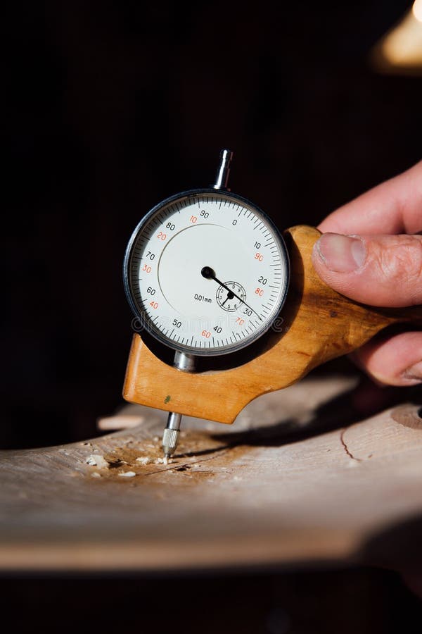 Master Artisan Luthier Working on the Creation of a Violin. Painstaking ...