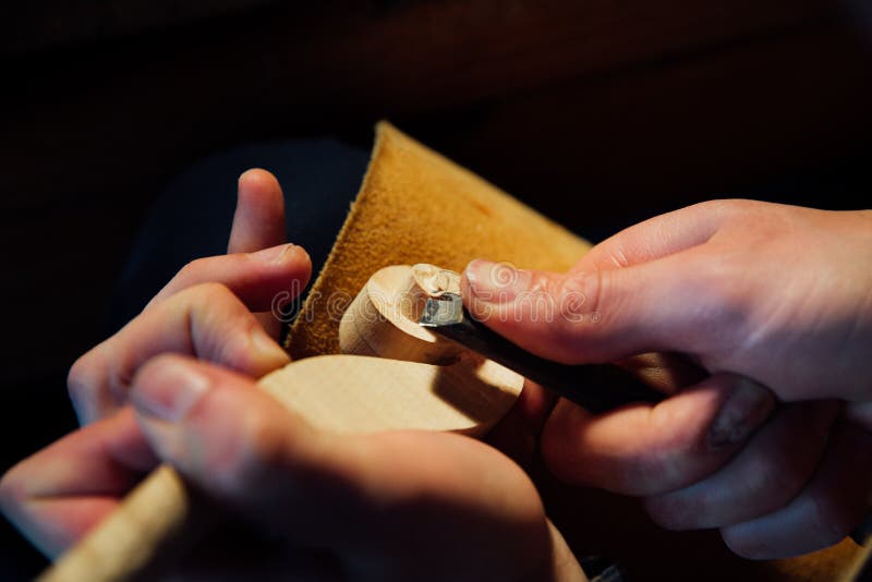 Master Artisan Luthier Working on the Creation of a Violin. Painstaking ...