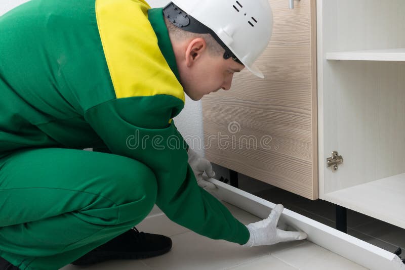 The Master of the Assembly, Installs the Lower Element of the Kitchen ...