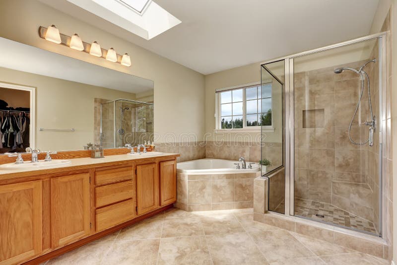 Master Bathroom with Corner Bathtub and Tile Floor Stock Image - Image ...