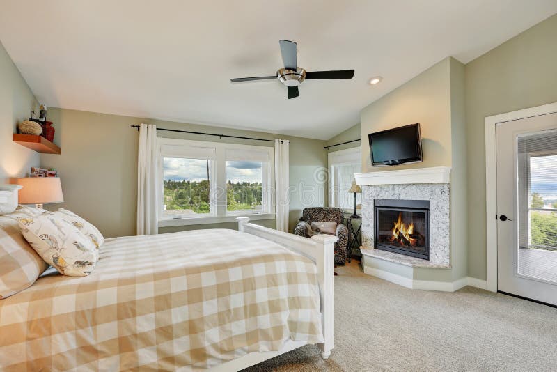 Master Bedroom Interior with Fireplace and Light Olive Walls. Stock ...