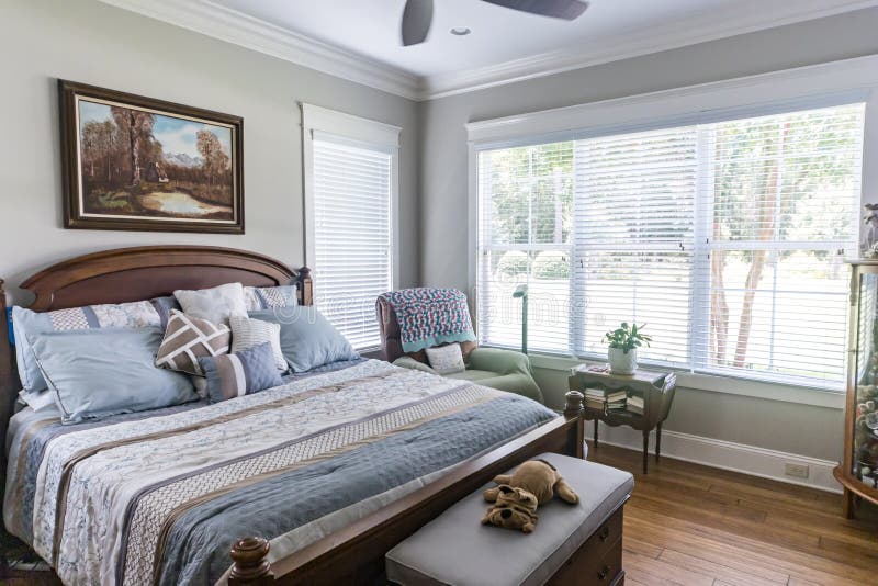 A Master Bedroom with a Large Picture Window Editorial Photo - Image of ...
