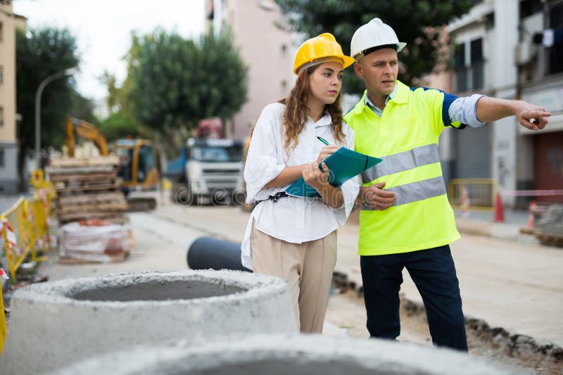 Master Builder and Architect Talking in Construction Area Stock Image ...